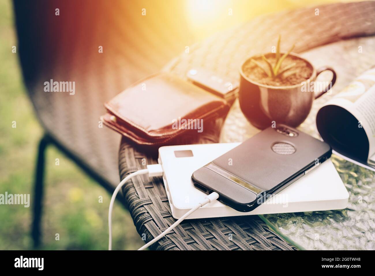 Charging the empty battery smartphone with white power bank Stock Photo ...