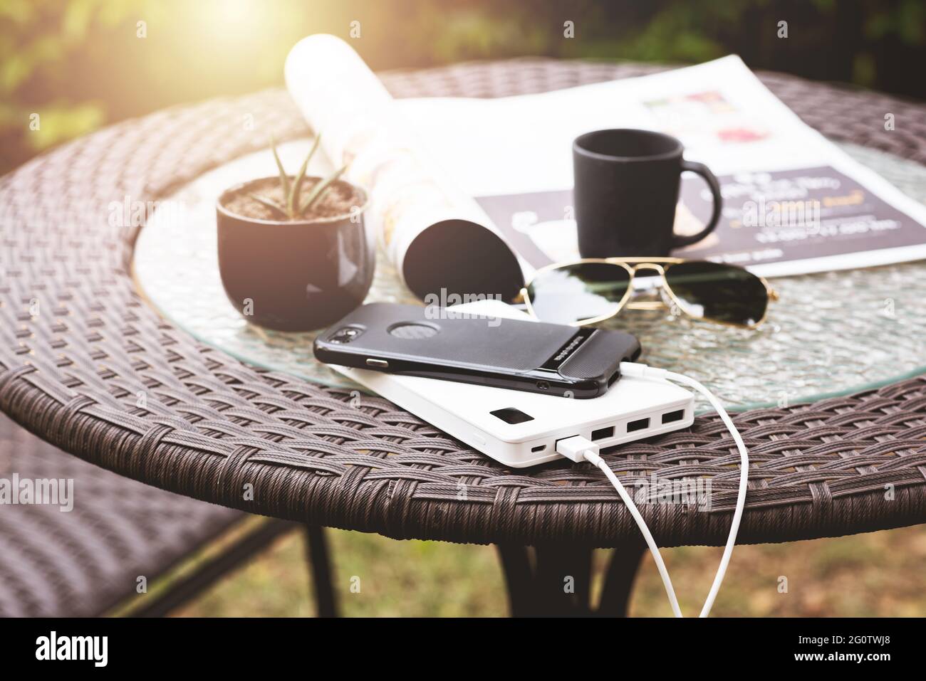 Charging the empty battery smartphone with white power bank Stock Photo ...