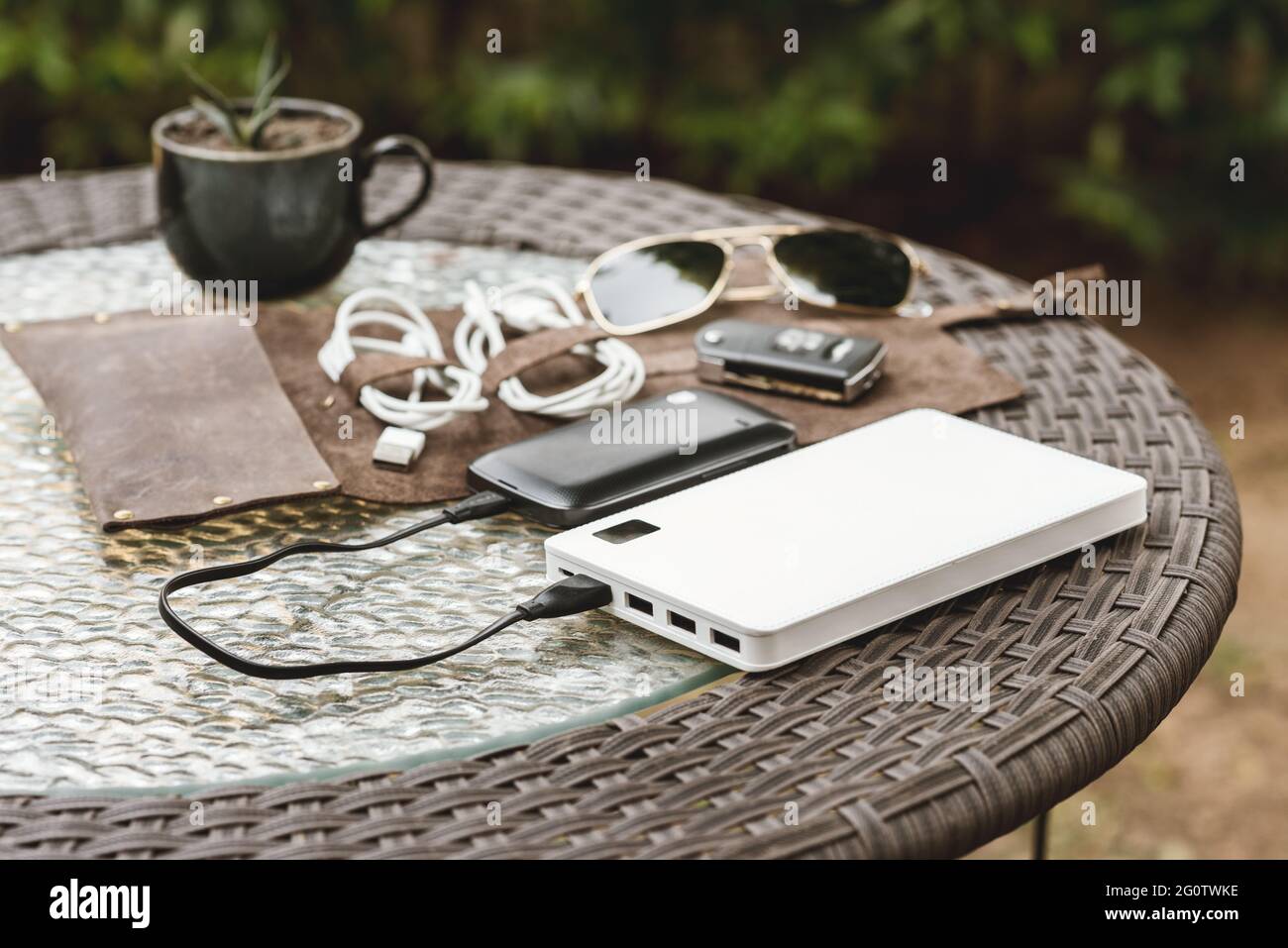 Charging the empty battery smartphone with white power bank Stock Photo ...