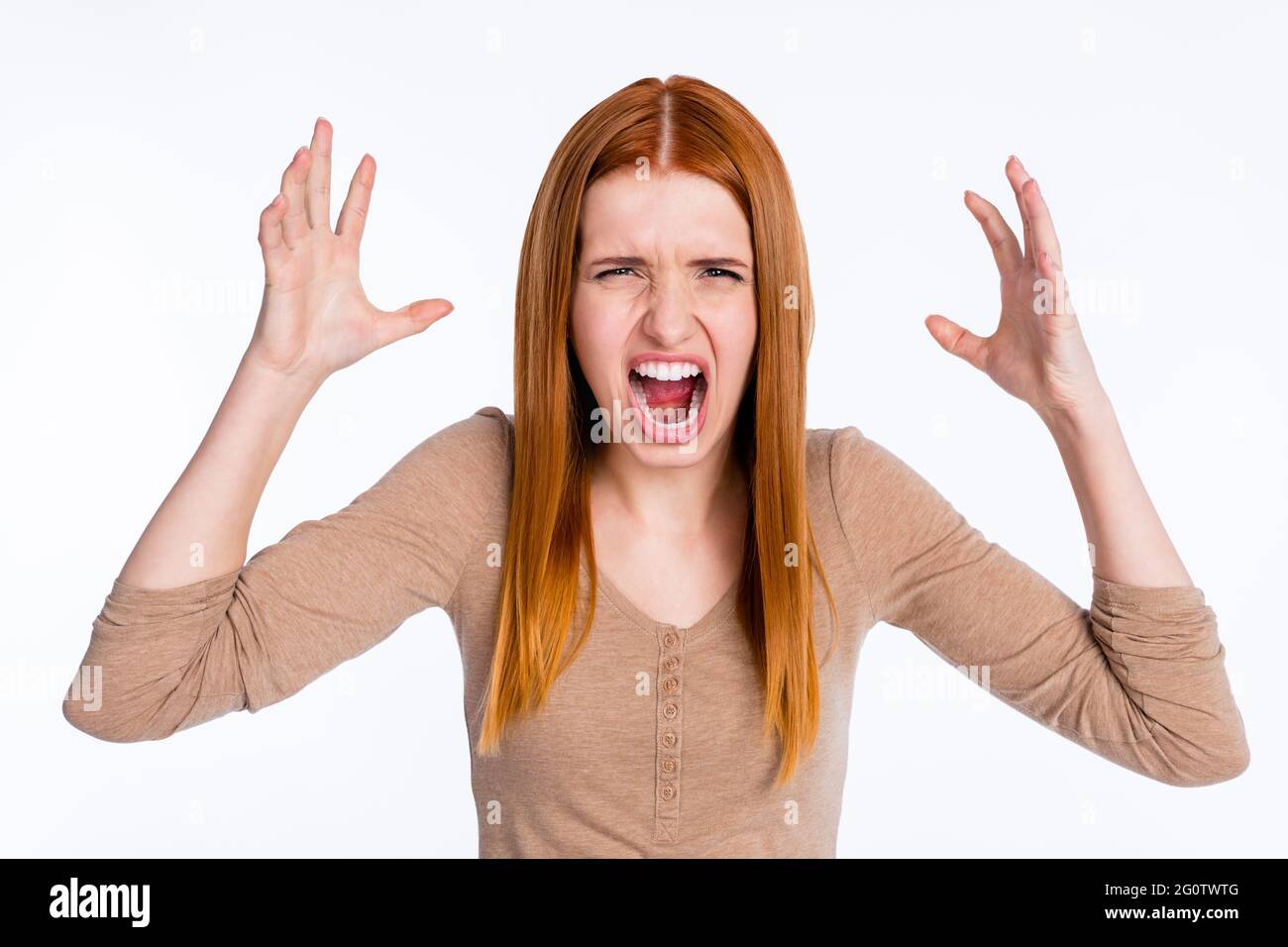 Photo of furious angry ginger lady wear beige shirt rising arms ...