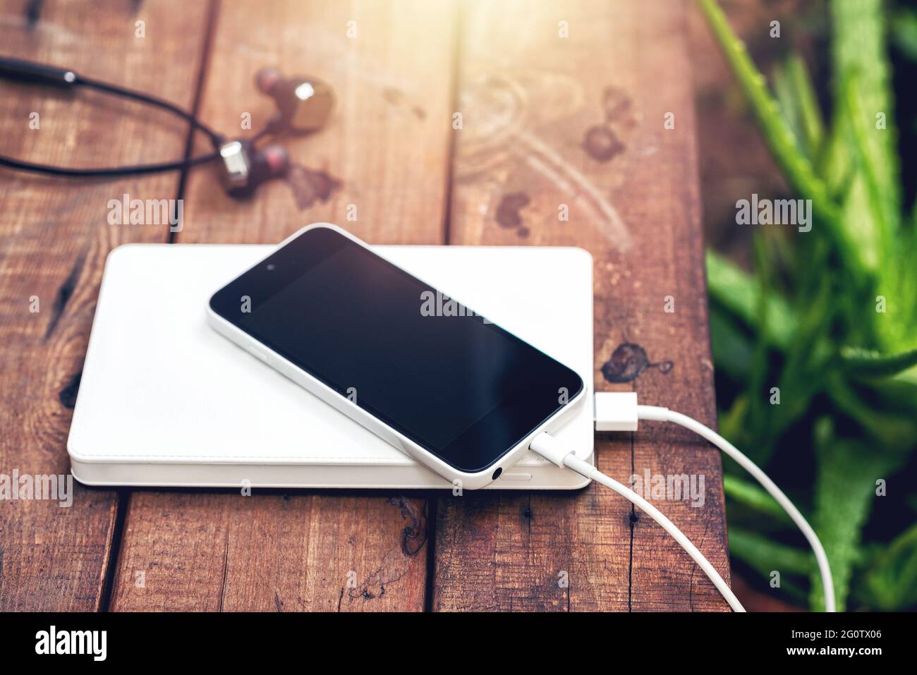 Charging the empty battery smartphone with white power bank Stock Photo ...