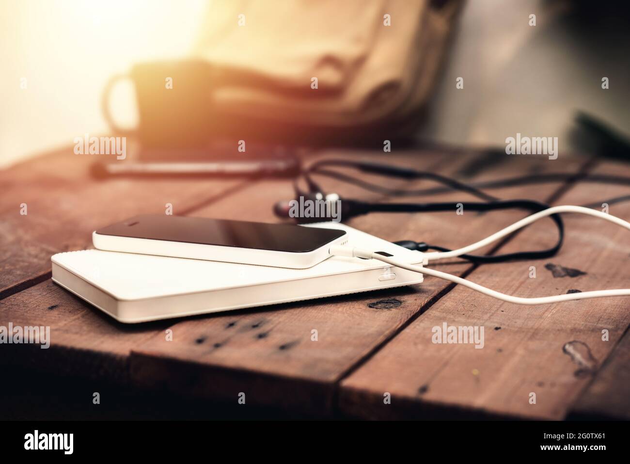 Charging the empty battery smartphone with white power bank Stock Photo ...