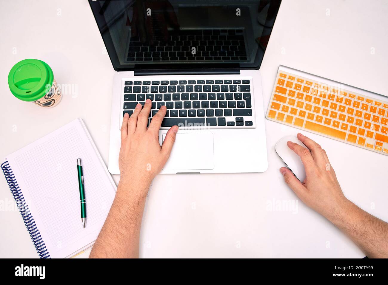 Man's hands using a laptop computer on a white background Stock Photo ...
