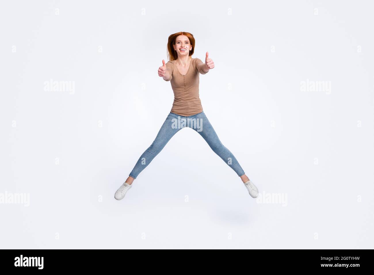 Full length photo of funky cute ginger lady wear beige shirt smiling ...