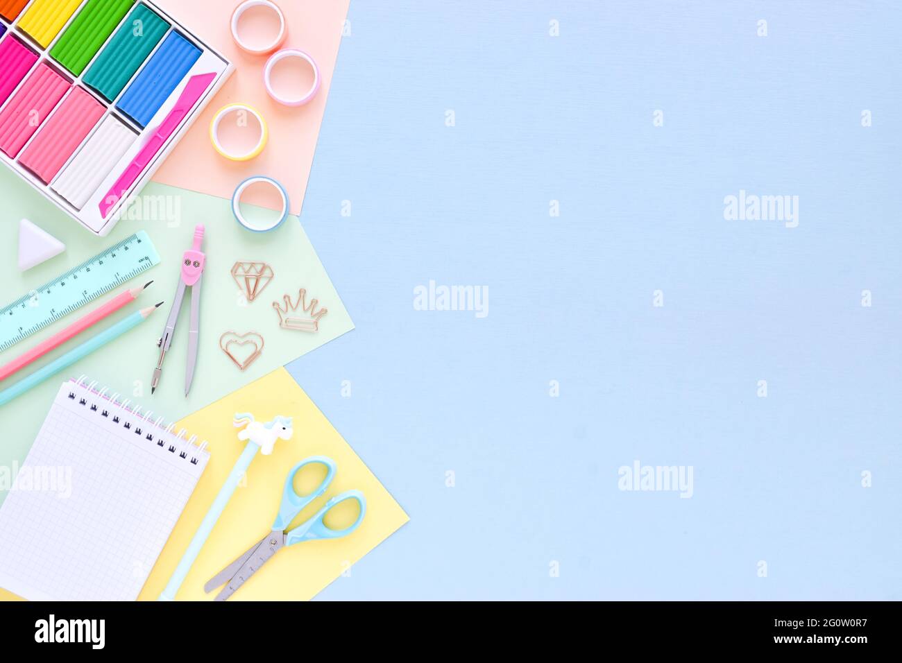 Stationery is placed on a pastel background instead of text. Empty ...