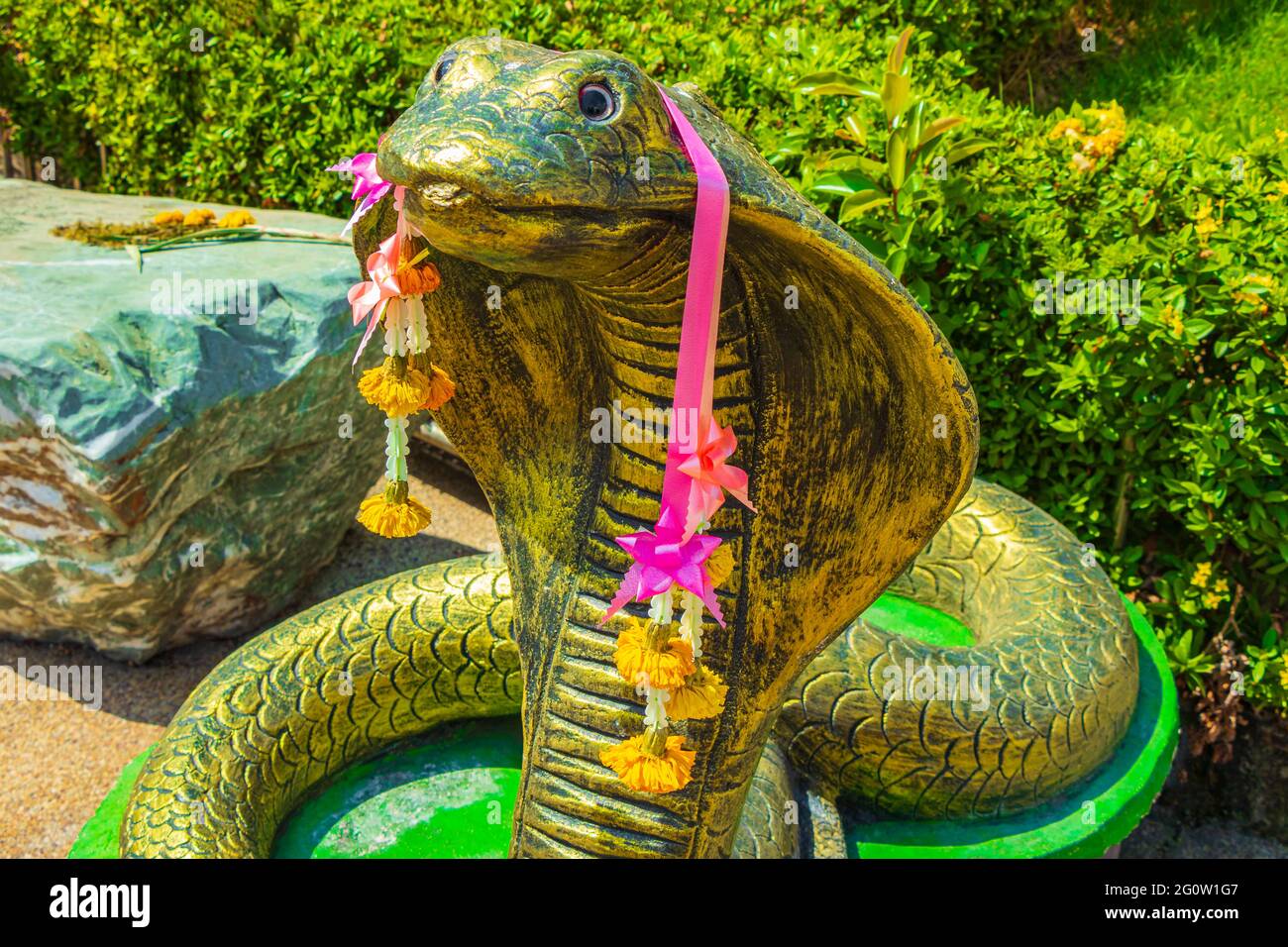 Green snake statues in amazing colorful Wat Don Mueang Phra Arramluang ...