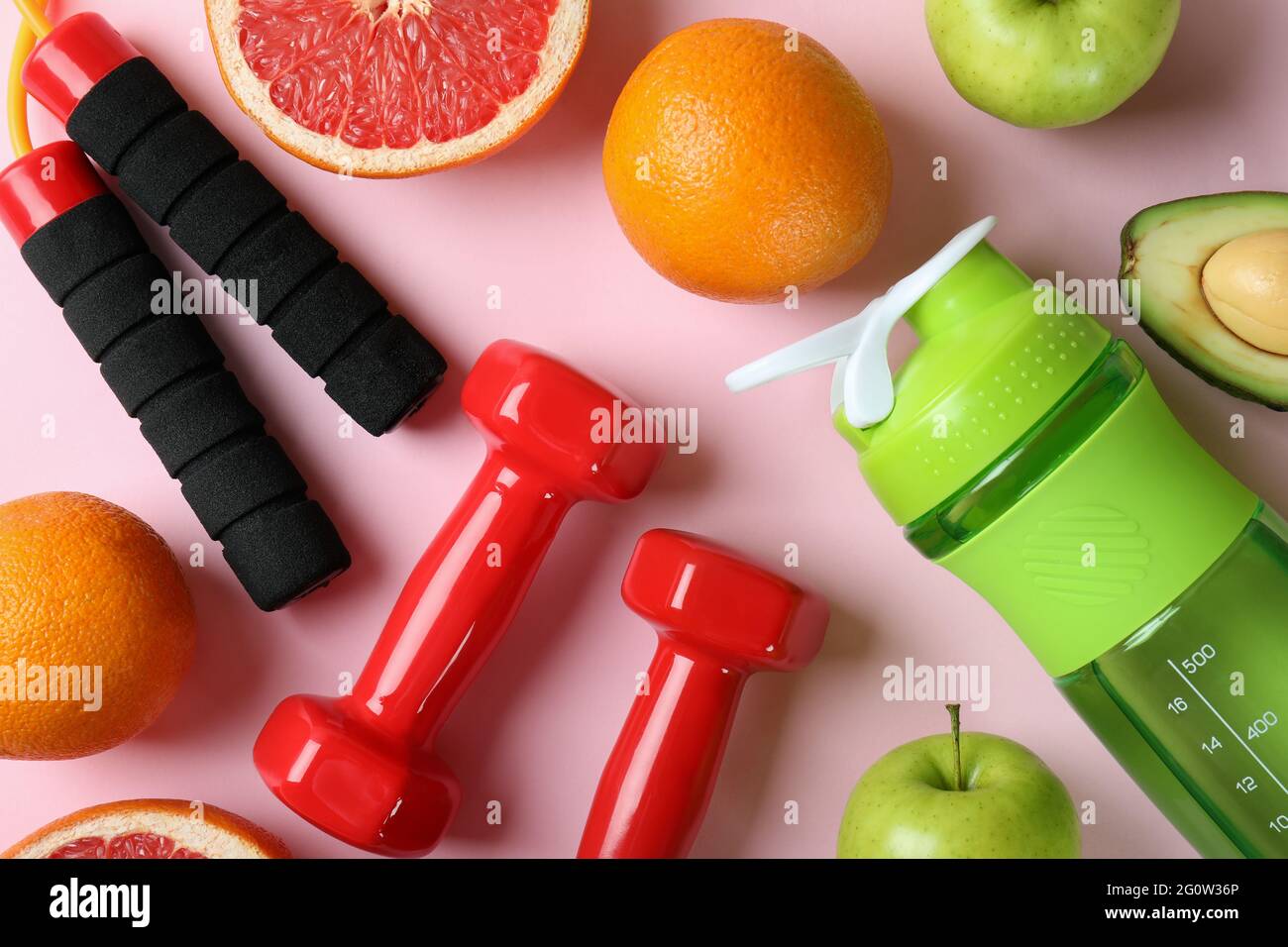 Healthy lifestyle accessories on pink background, top view Stock Photo ...