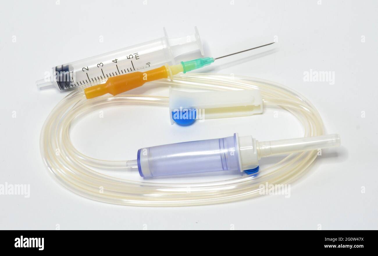 Intravenous infusion set with syringe isolated on white background ...