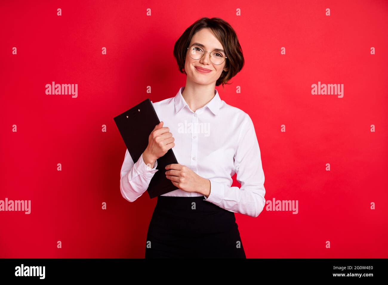 Photo of happy positive lovely charming secretary in glasses hold ...