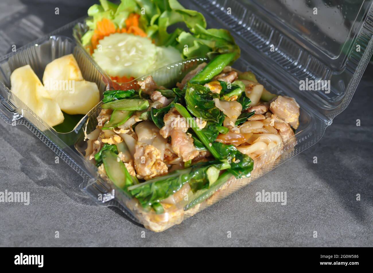 stir fried noodles with pork and vegetable in the box ,food set Stock ...