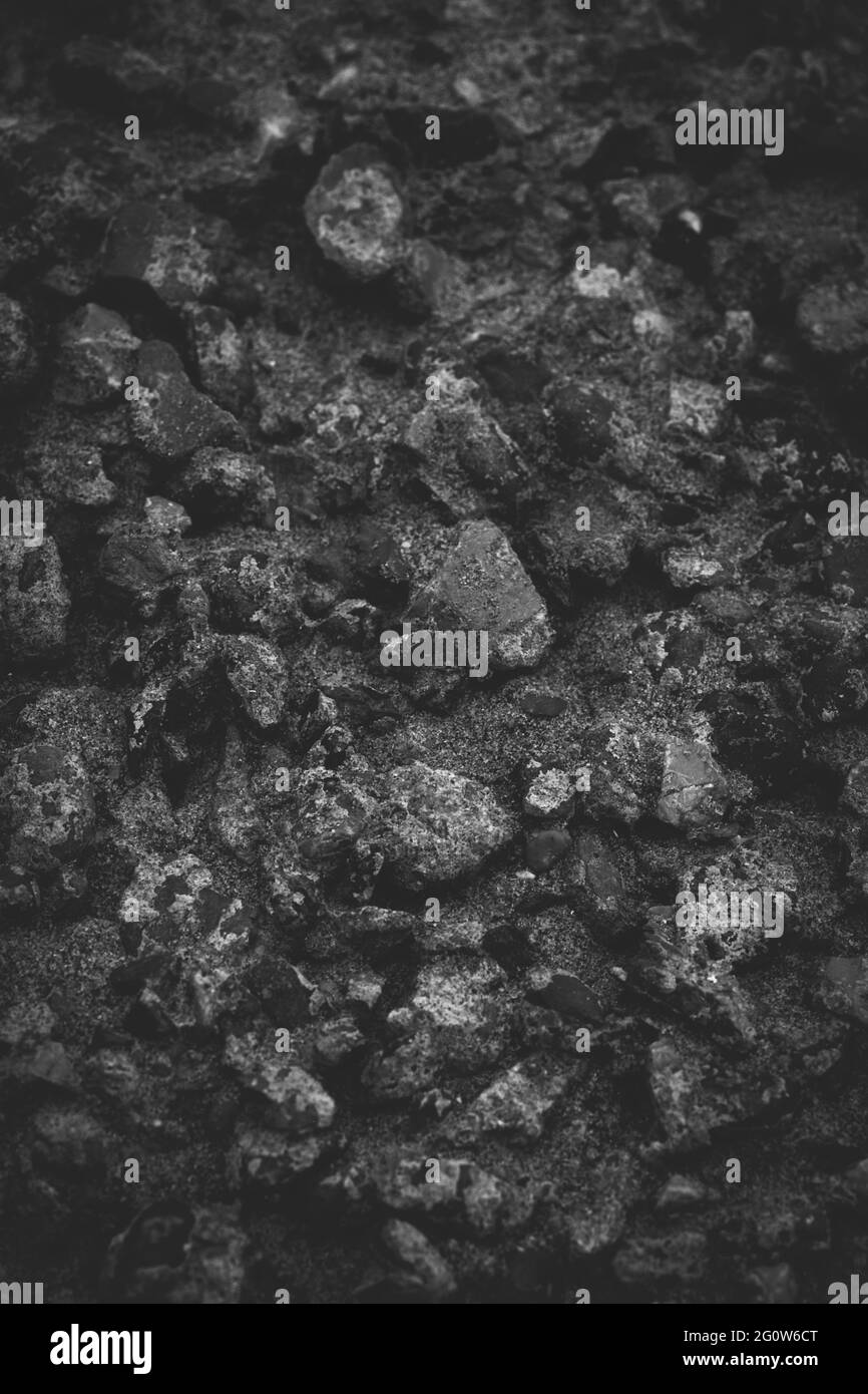 Closeup of dark rock textured background. Gray rough stone texture and ...