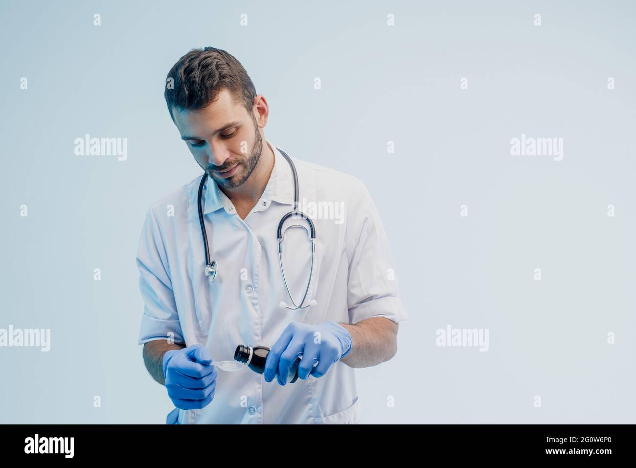 Man doctor cough syrup hi-res stock photography and images - Alamy