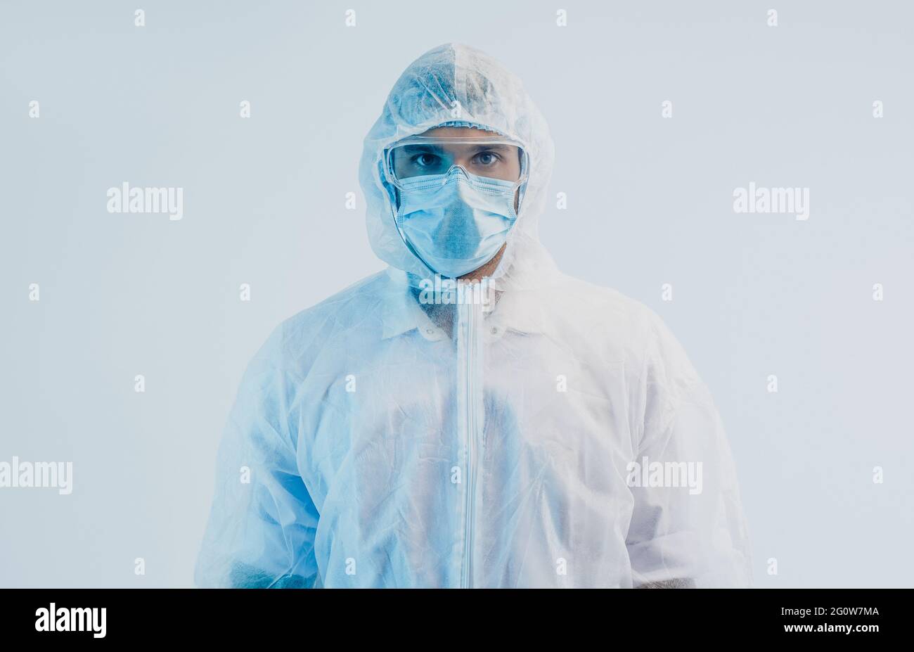 Male doctor wearing white coat and protective mask Stock Photo - Alamy