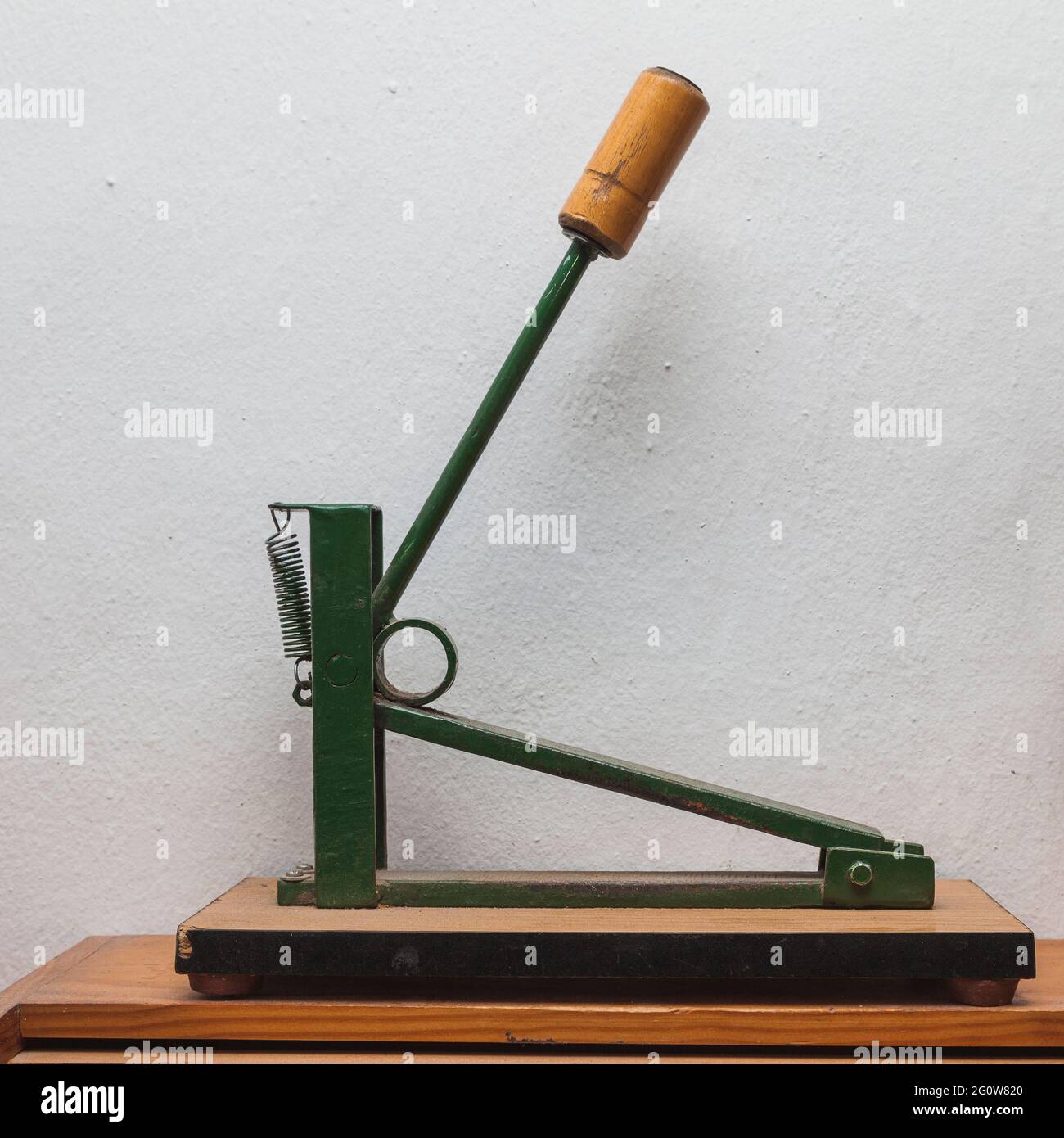 Rustic scene with an antique nutcracker with lever mechanism over a ...