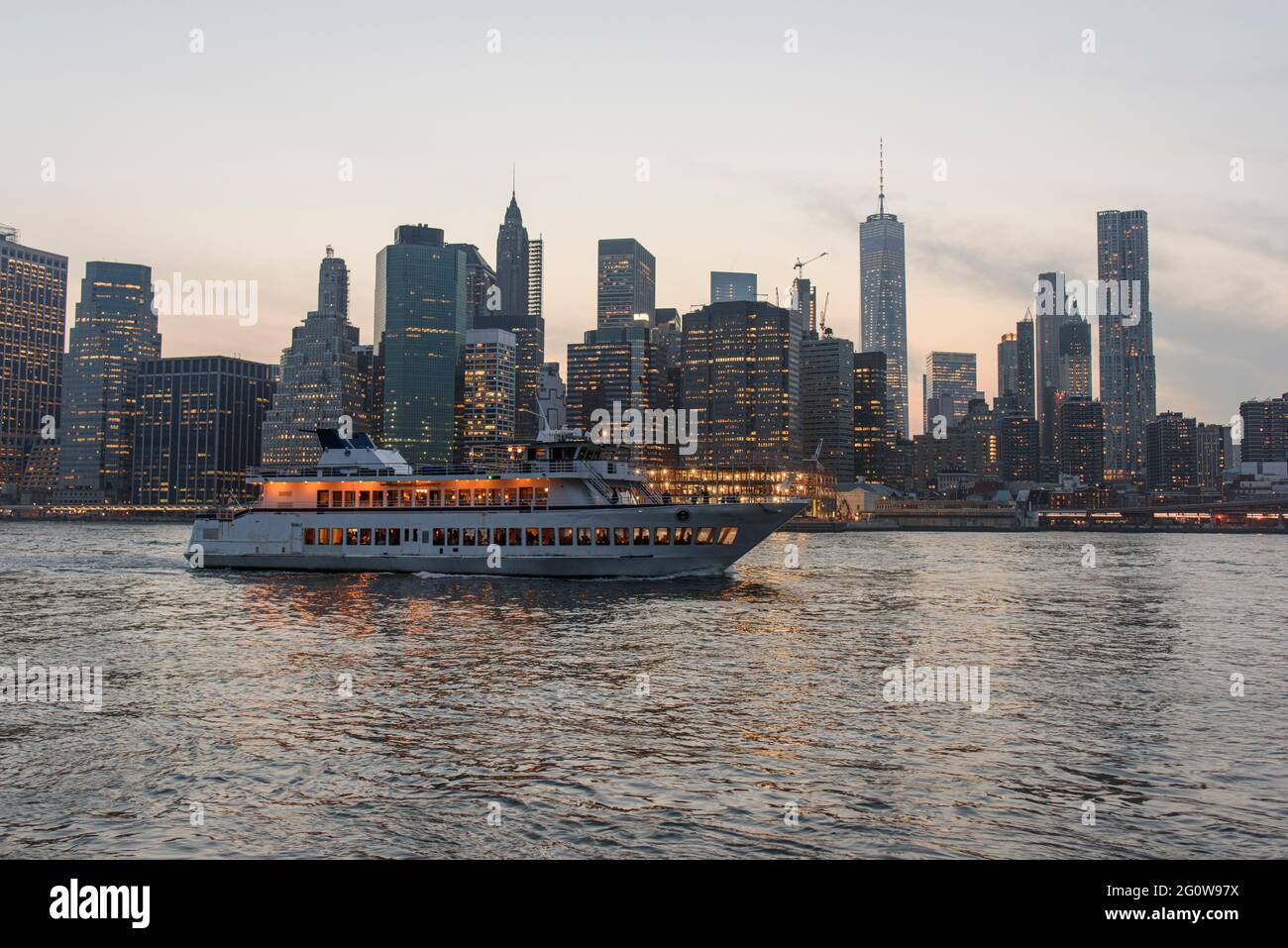 Ship on river near buildings in town Stock Photo - Alamy