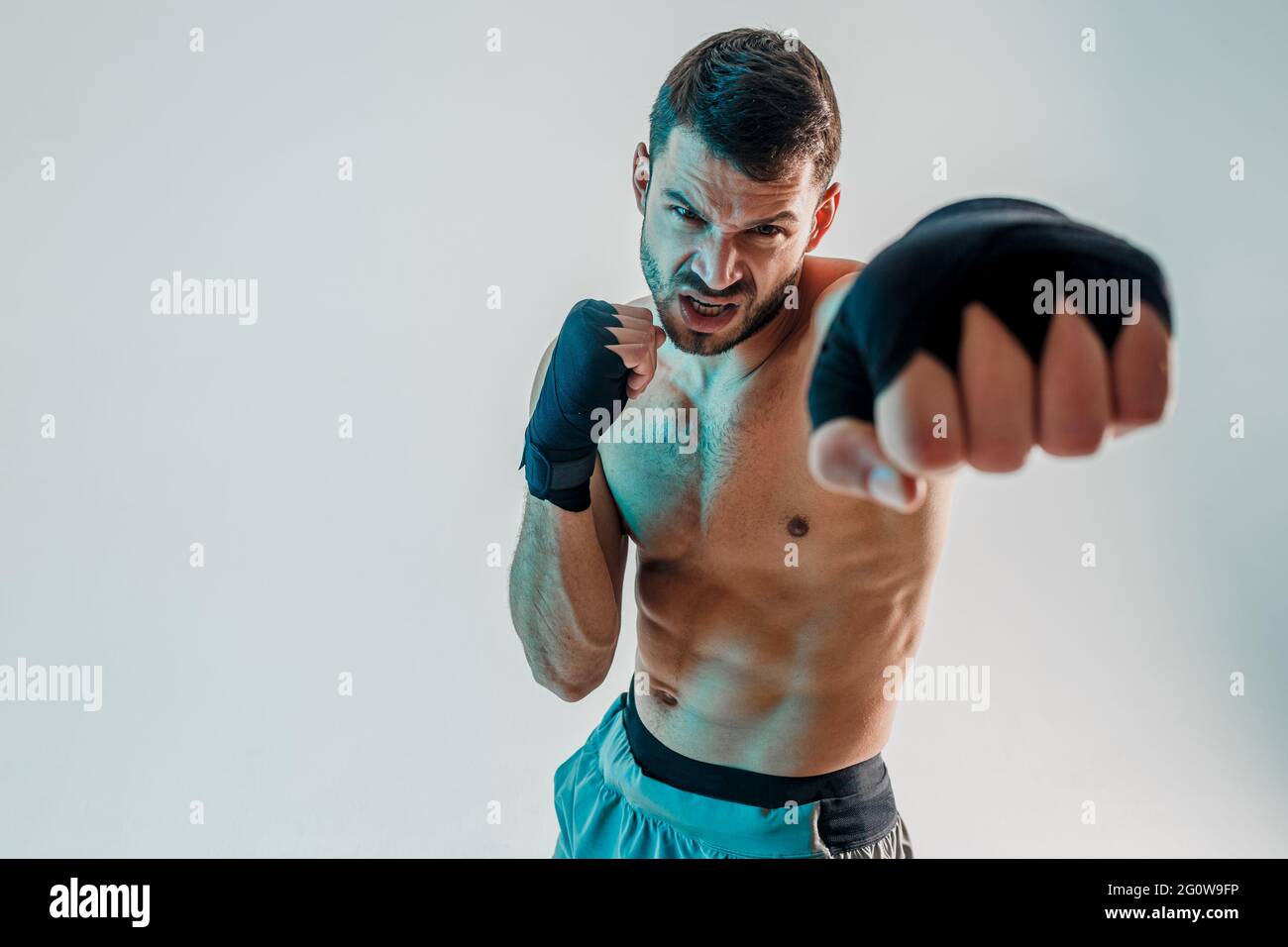 Angry young bearded european boxer is boxing Stock Photo - Alamy
