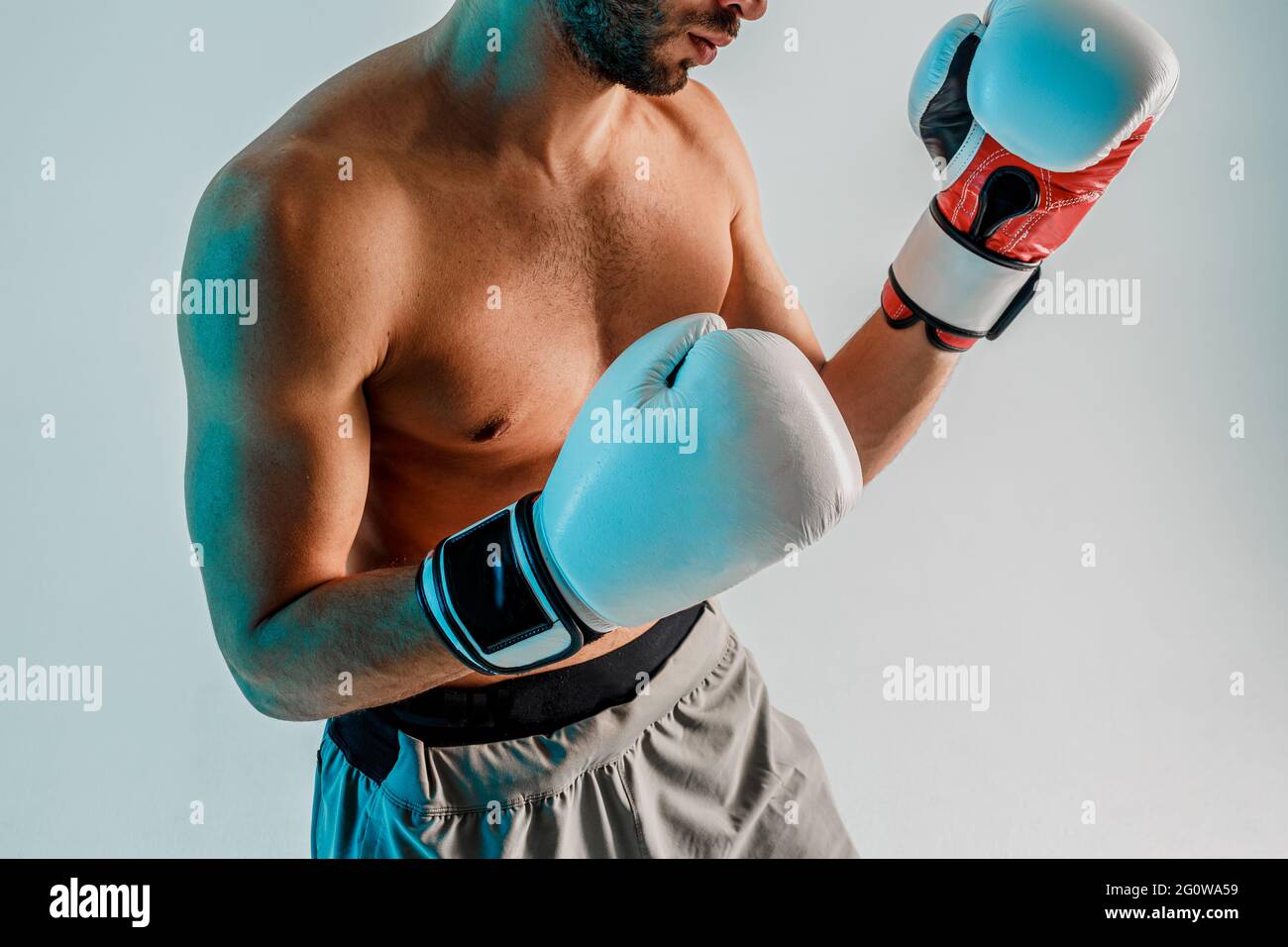 Partial view of young bearded boxer is boxing Stock Photo - Alamy