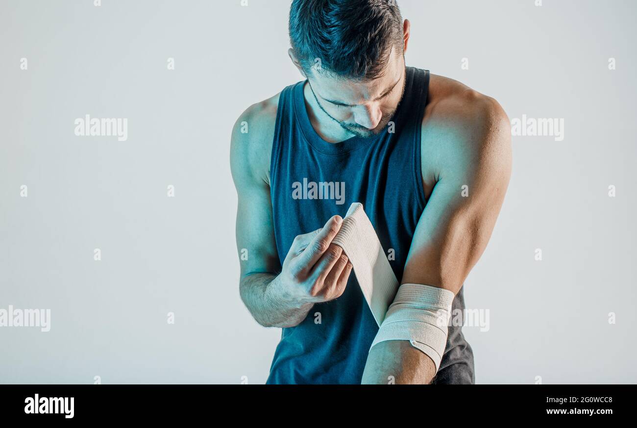 Man wrapping hand injury bandage hi-res stock photography and images ...