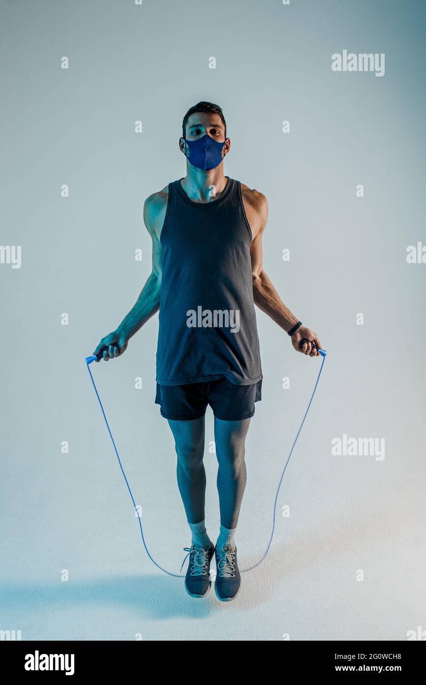 Focused young sportsman jumping rope hi-res stock photography and ...