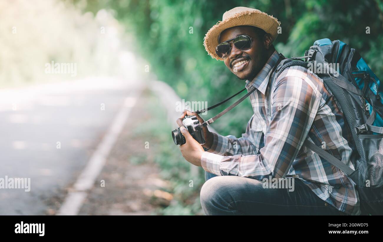 Traveling african male tourist backpackers taking photo side of the ...