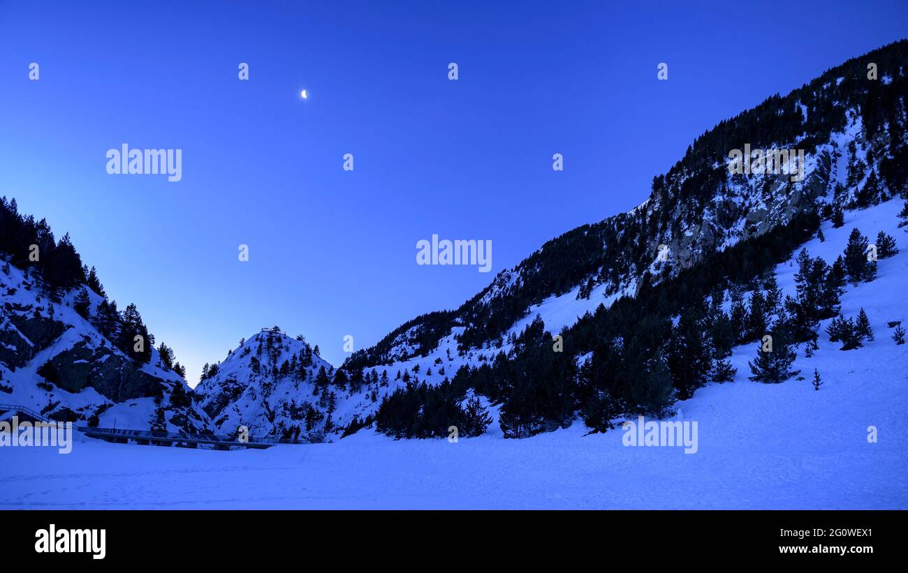 Lake of the Núria Sanctuary in a winter , at the morning blue hour ...