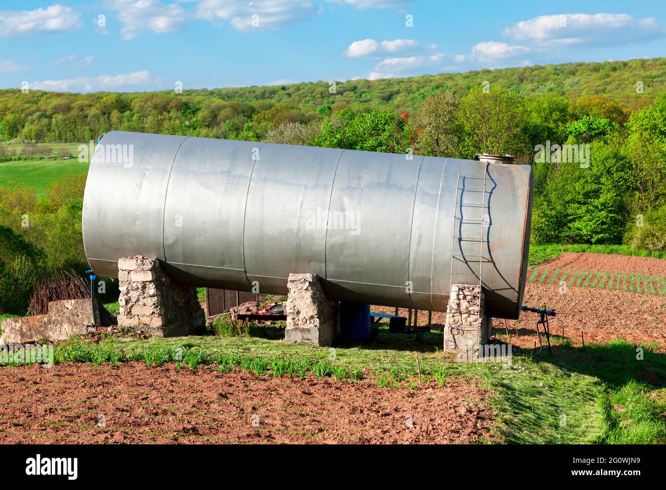 Large Barrel for Irrigation at the Agricultural Field . Irrigation ...