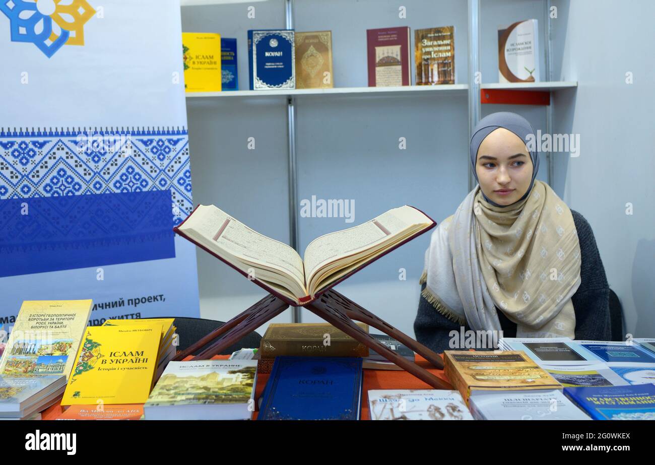 Young pretty muslim girl presents islamic books in the bookshop, Quran ...