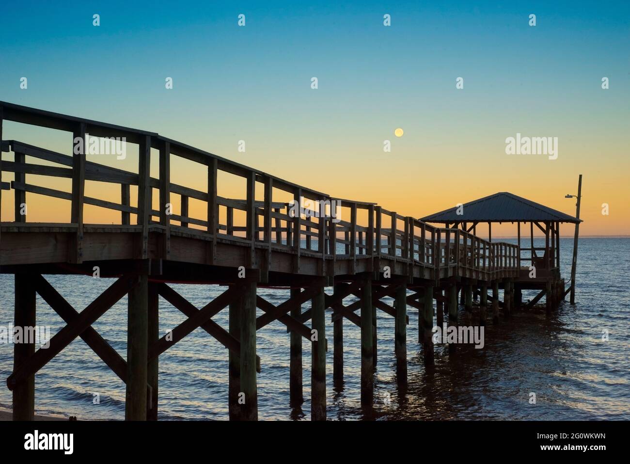 The first full moon of the year sets over Mobile Bay as seen from ...