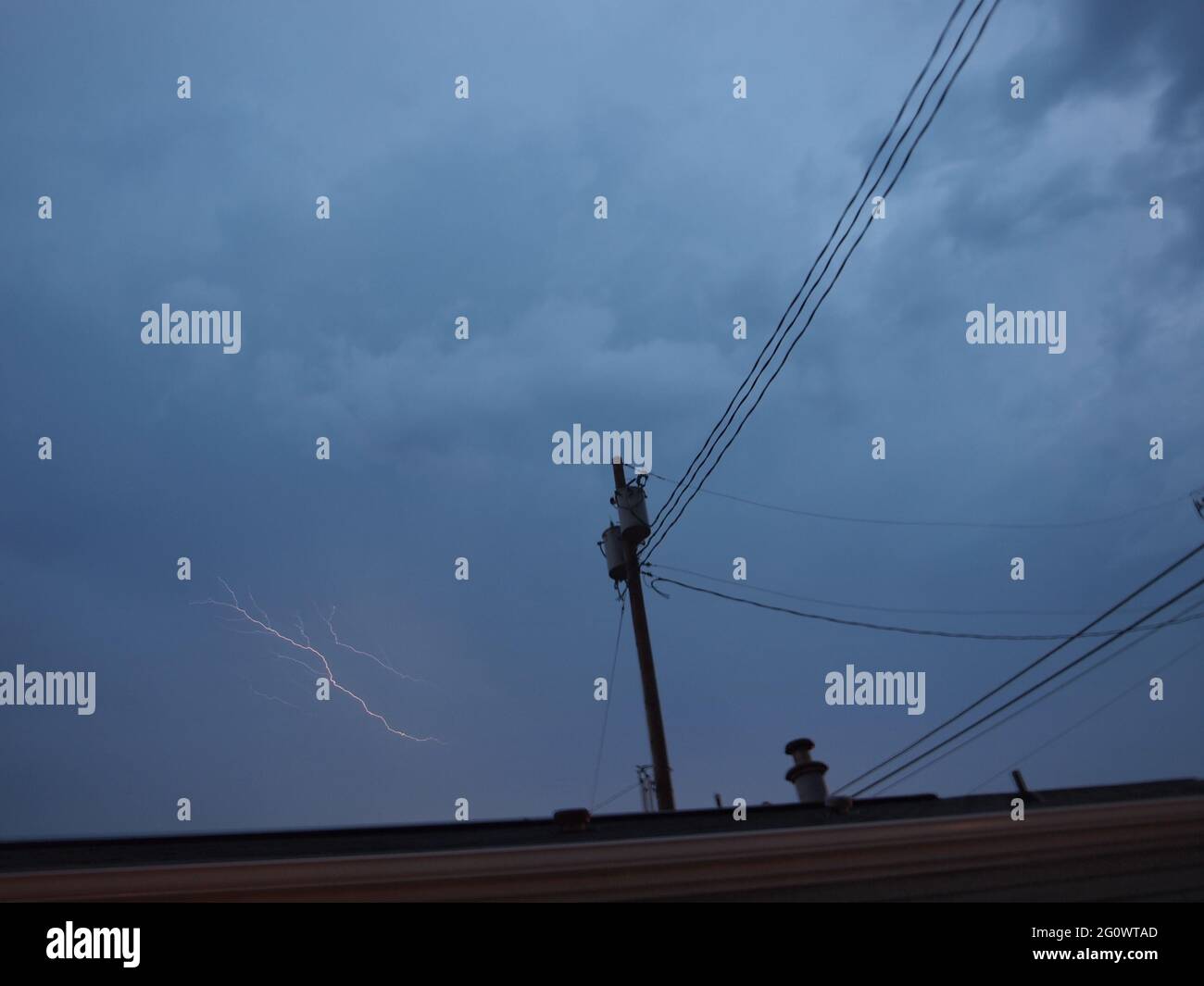 Dark storm clouds over the New Jersey shoreline with a small lightning ...