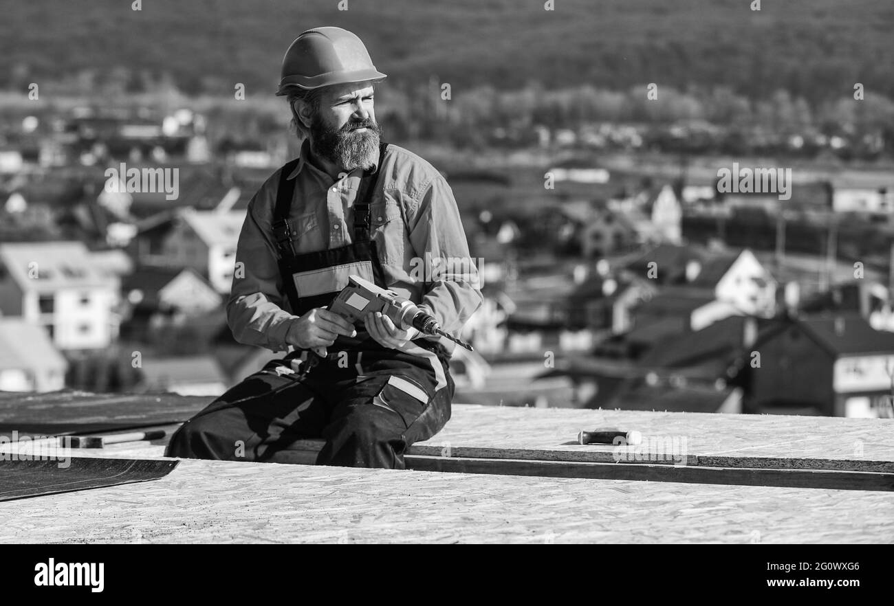 Roofer constructing roof. Man roofing surface. Materials requirements ...