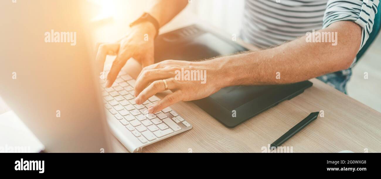 Writer typing modern computer keyboard writing novel sitting at the ...