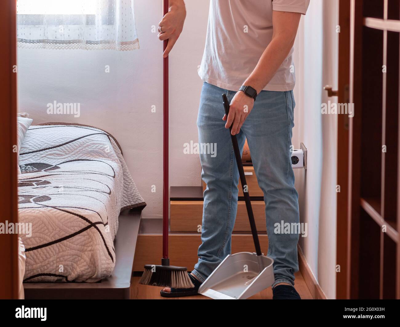 Man with a broom hi-res stock photography and images - Alamy