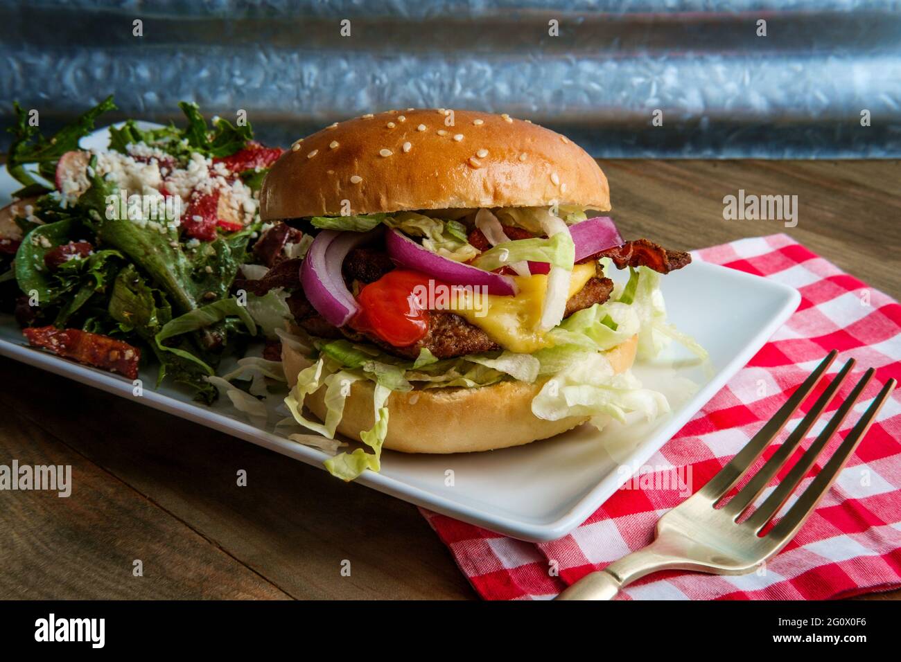 Angus beef cheeseburger topped with crispy bacon served with a side ...