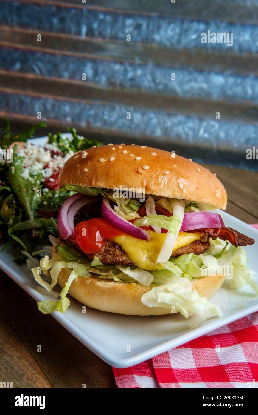 Angus beef cheeseburger topped with crispy bacon served with a side ...