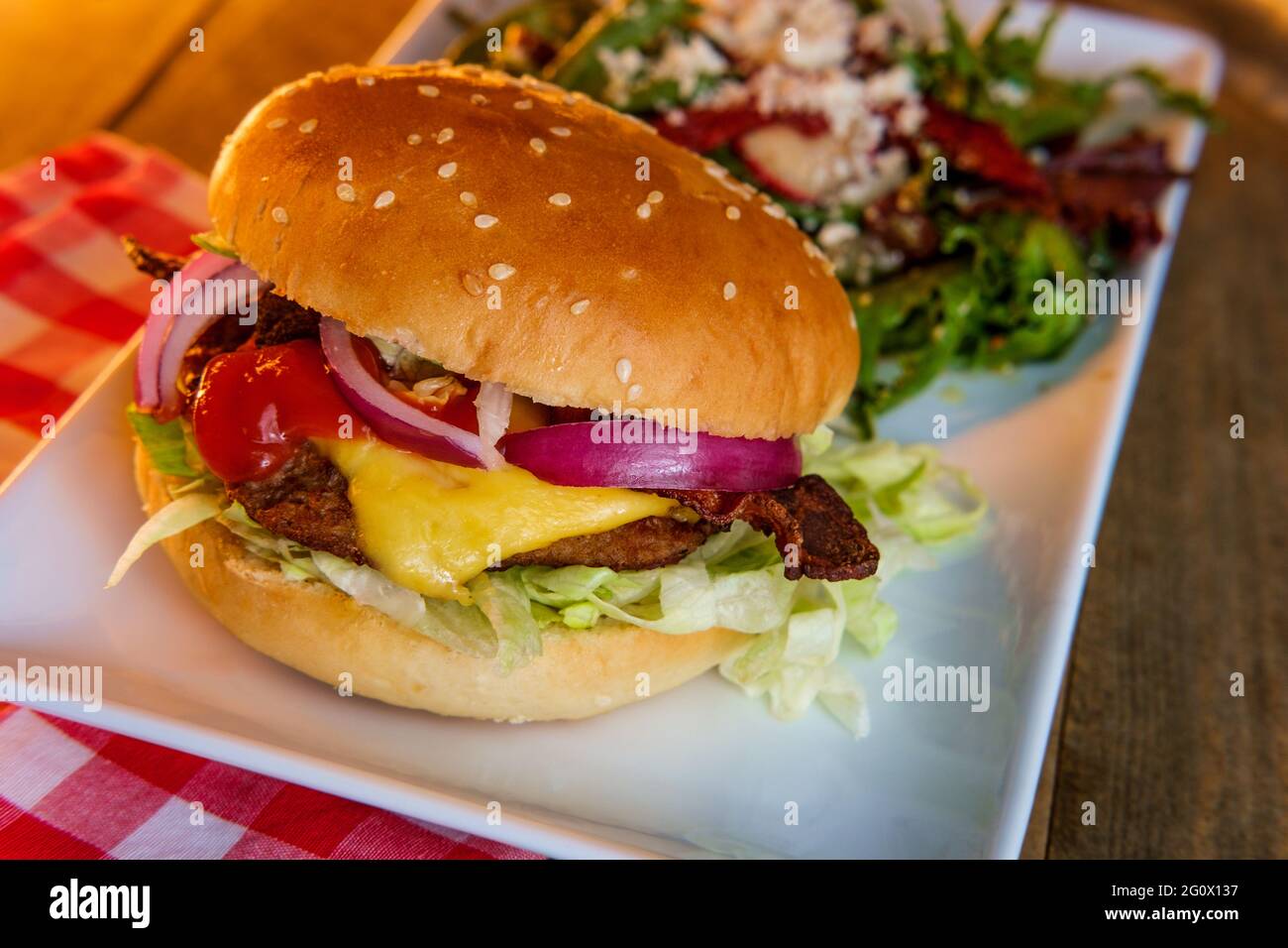 Angus beef cheeseburger topped with crispy bacon served with a side ...