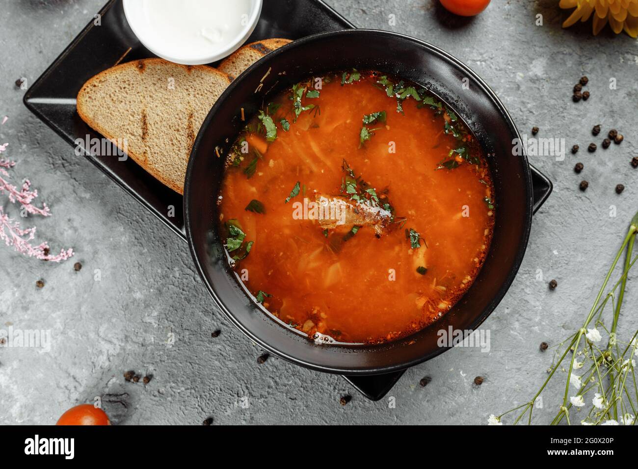 Traditional Ukrainian Russian borscht with white beans on the black ...