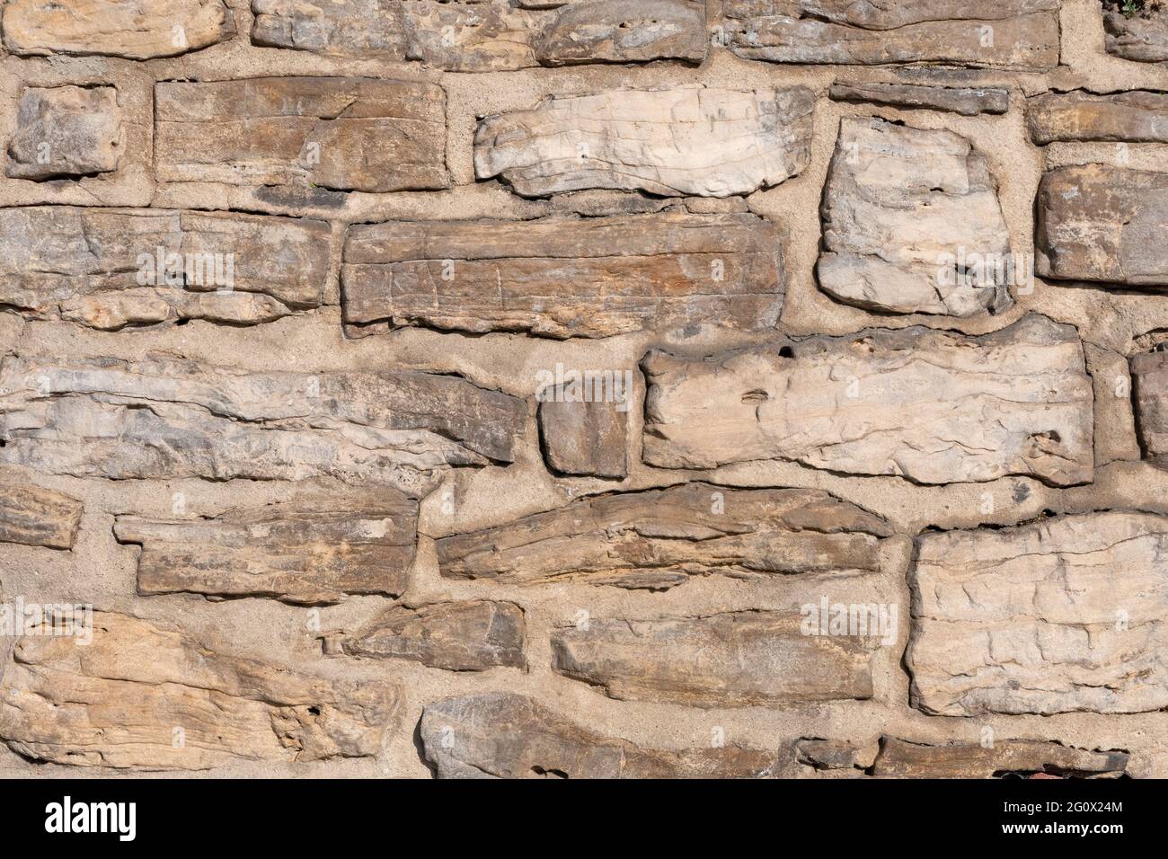 Wall made of natural stones Stock Photo - Alamy
