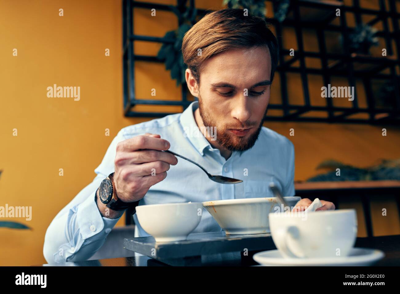 man eating lunch in a restaurant hot broth food break at work Stock ...