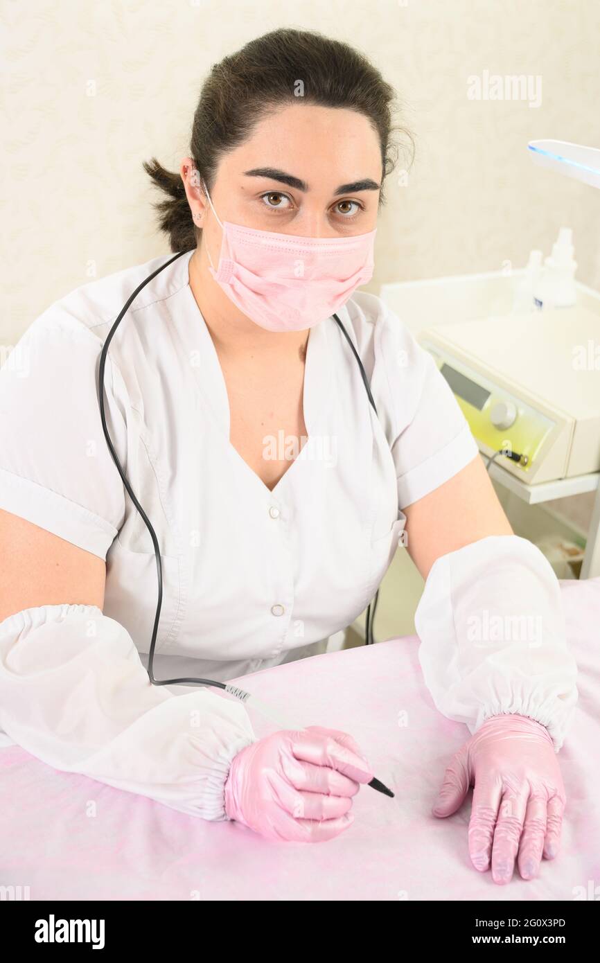 Electrologist is waiting patient for remove hair by method ...