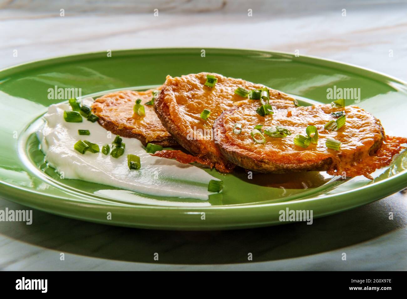 Oven roasted potato rounds hi-res stock photography and images - Alamy