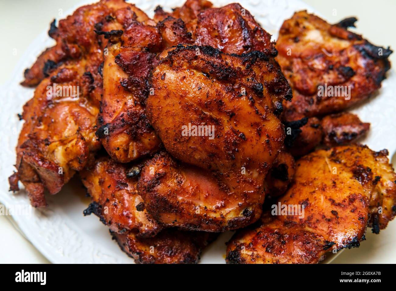 Grilled Memphis rubbed skinless boneless chicken thighs on server ...