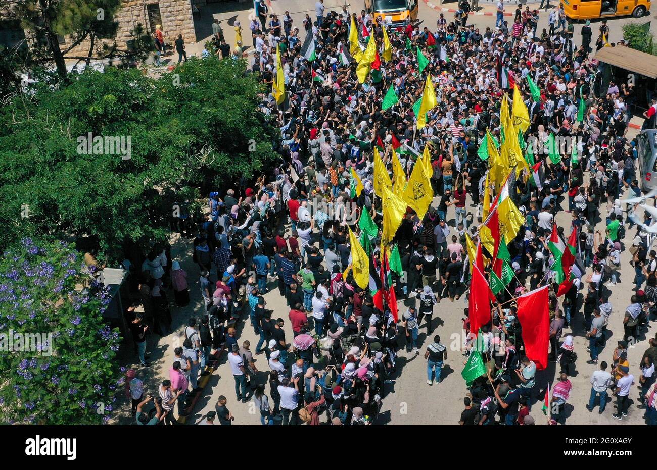 Birzeit, West Bank, Palestine. 03 June 2021. Mourners raise Palestinian ...