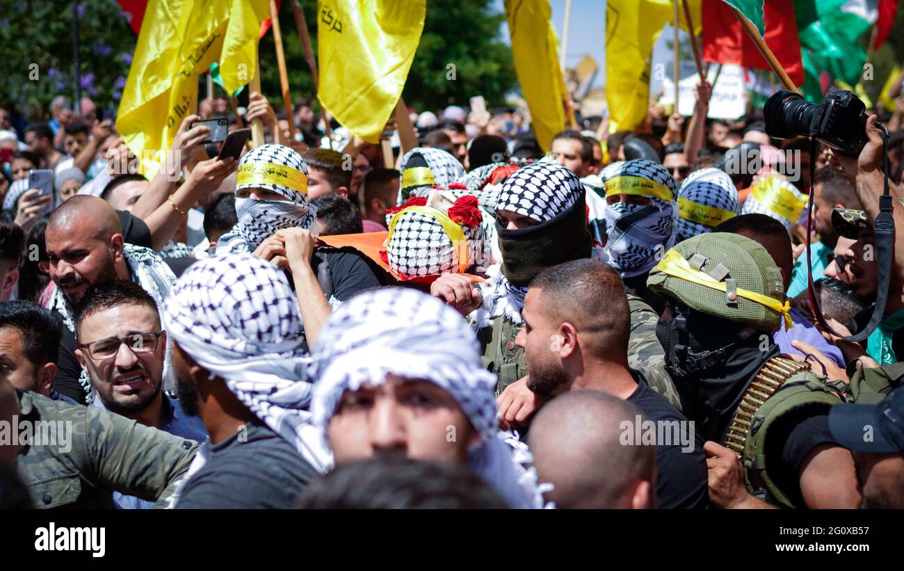 Birzeit, West Bank, Palestine. 03 June 2021. Mourners raise Palestinian ...