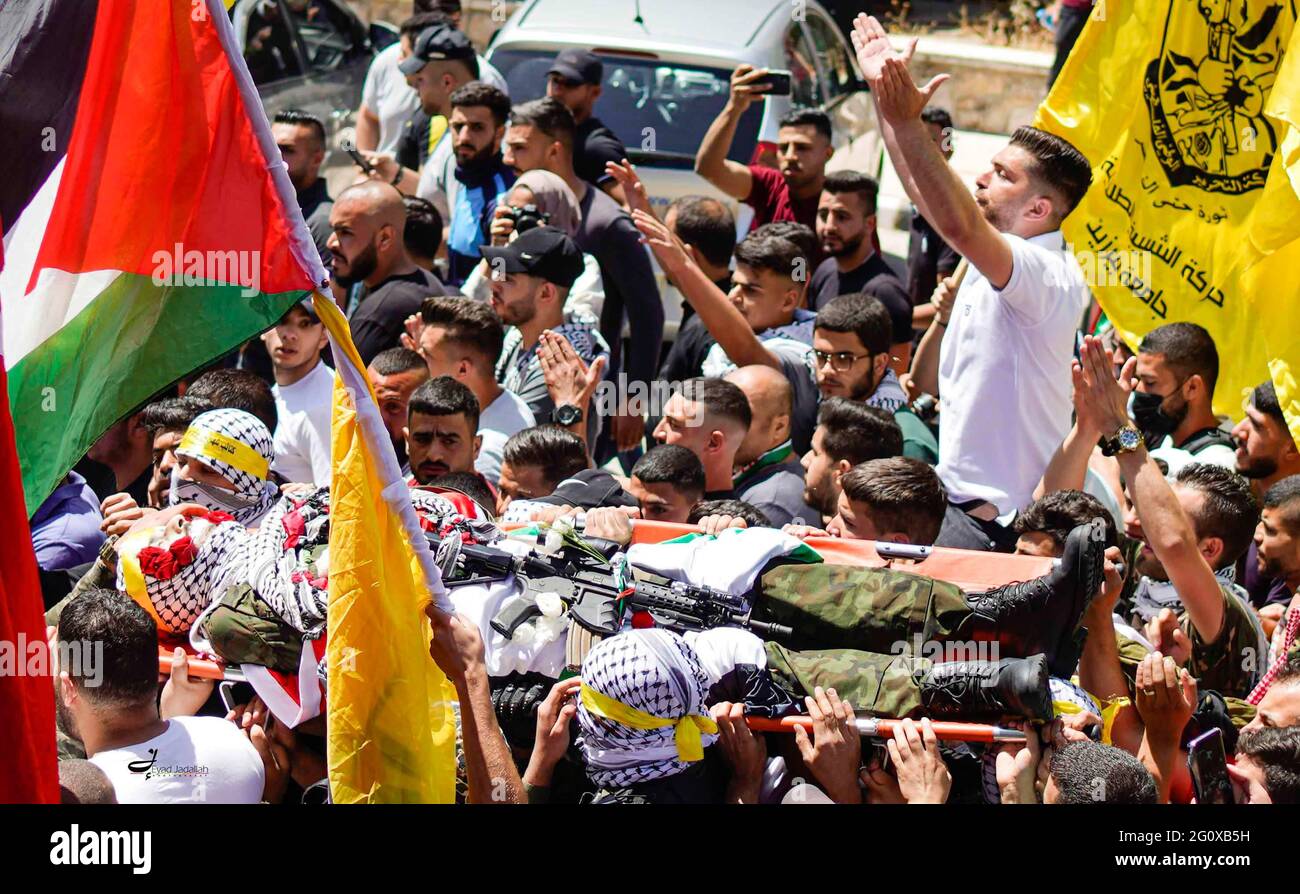 Birzeit, West Bank, Palestine. 03 June 2021. Mourners raise Palestinian ...