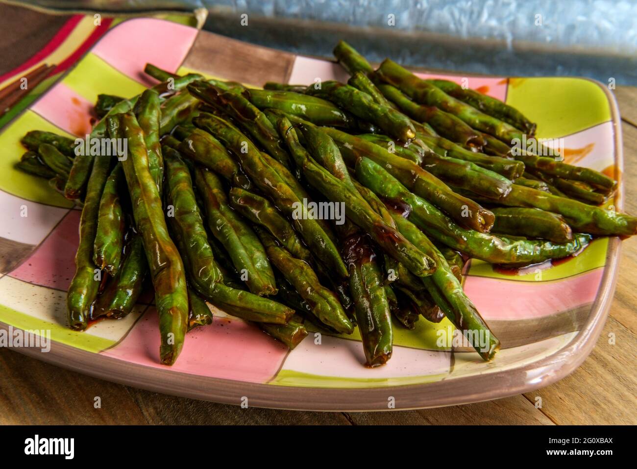 Chinese spicy sichuan garlic string beans with chop sticks Stock Photo ...