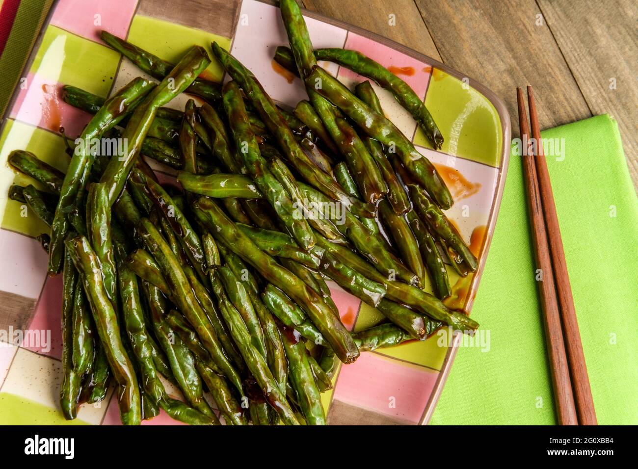 Chinese spicy sichuan garlic string beans with chop sticks Stock Photo ...