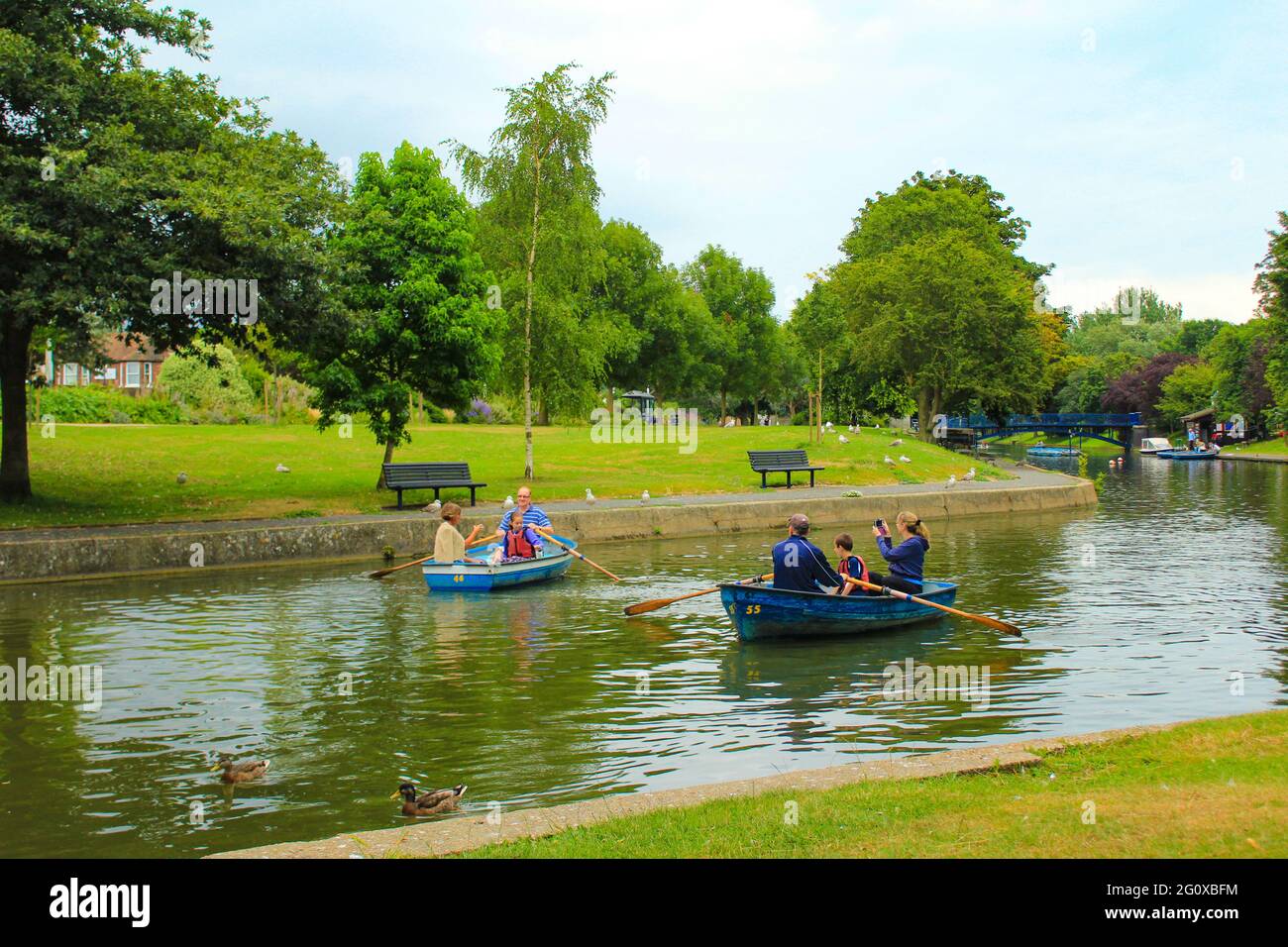 Family in old row boat hi-res stock photography and images - Alamy