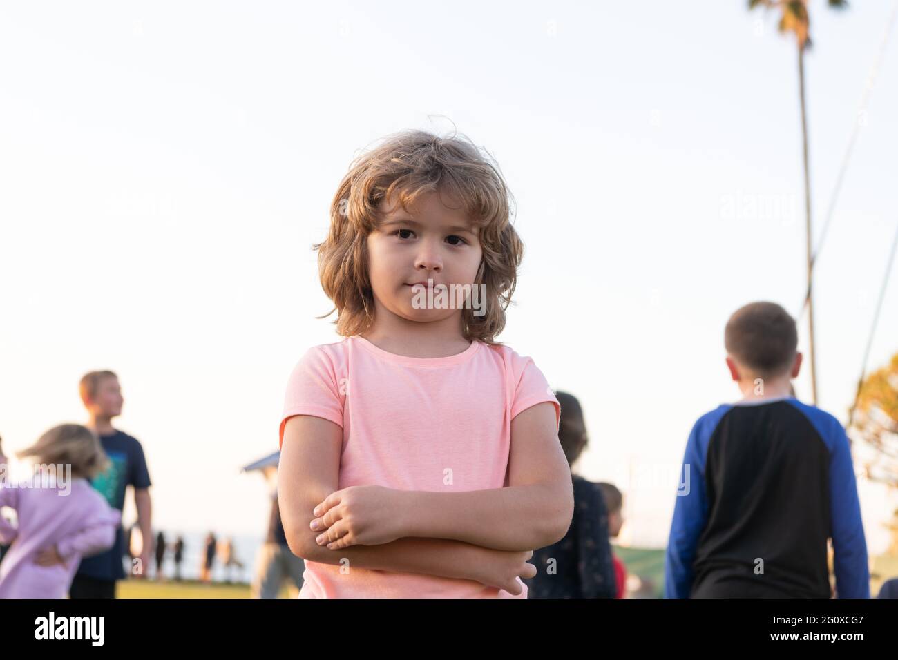 Serious boy child keep arms crossed summer outdoors, kid Stock Photo ...