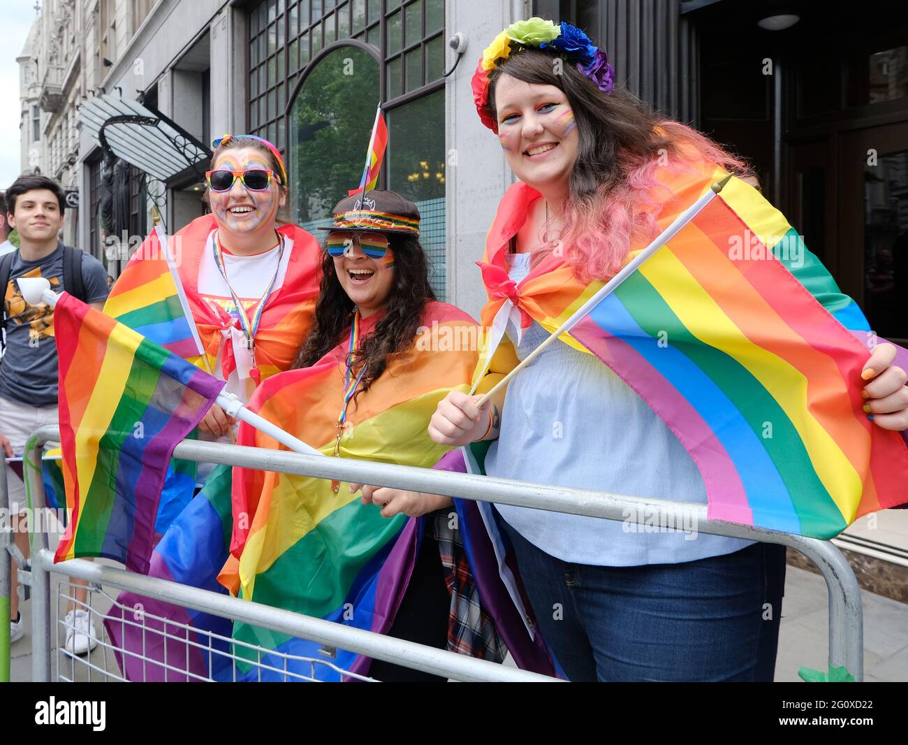 Female revellers draped in rainbow flags enjoy the Jubilee Pride in ...