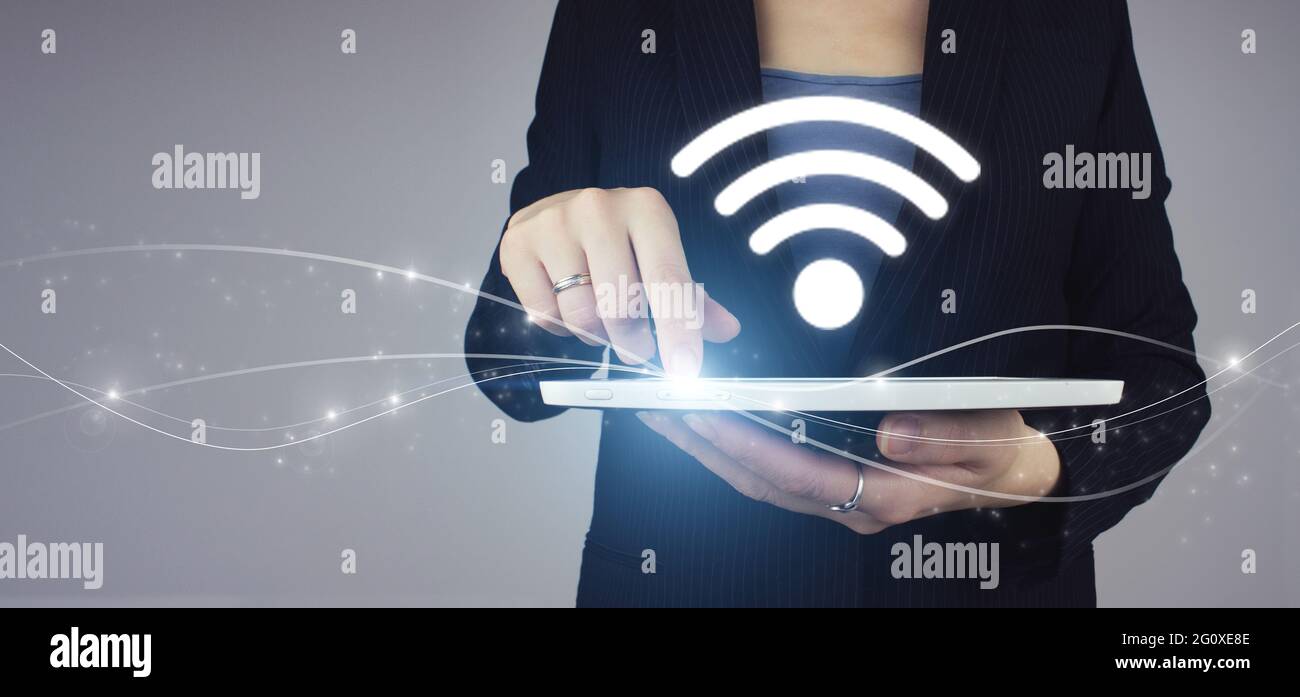 Free WiFi network signal technology internet concept. White tablet in ...